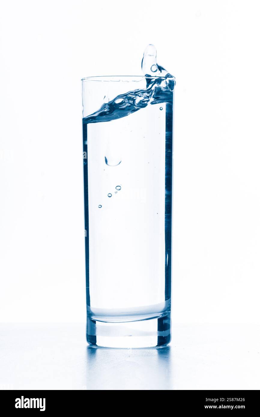 water splashing from glass isolated on white background Stock Photo - Alamy