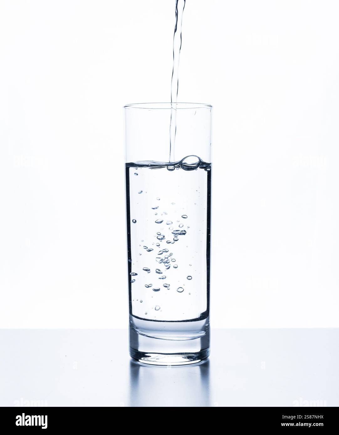 water splashing from glass isolated on white background Stock Photo - Alamy