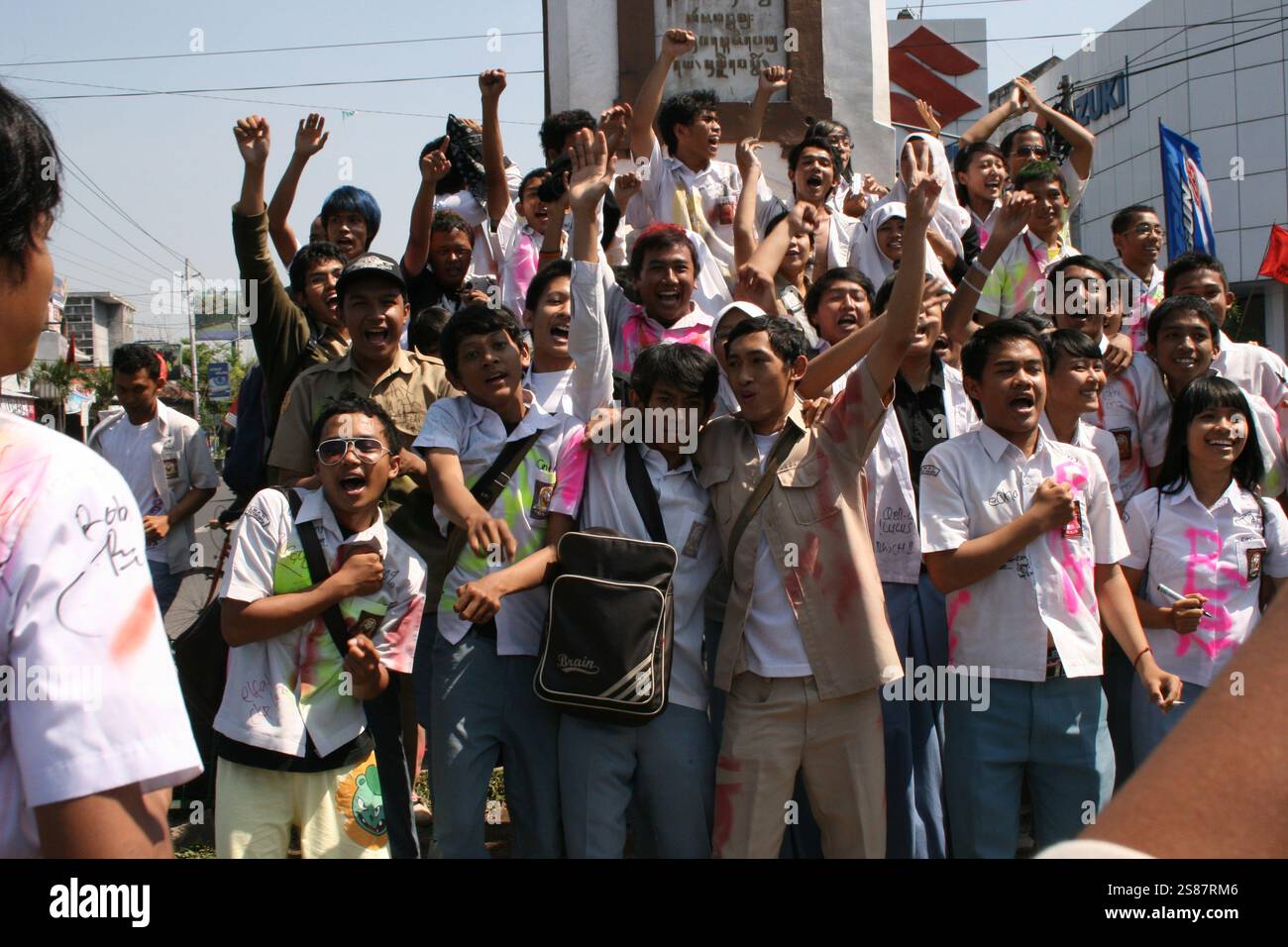 Expressions of high school students celebrating their graduation by ...