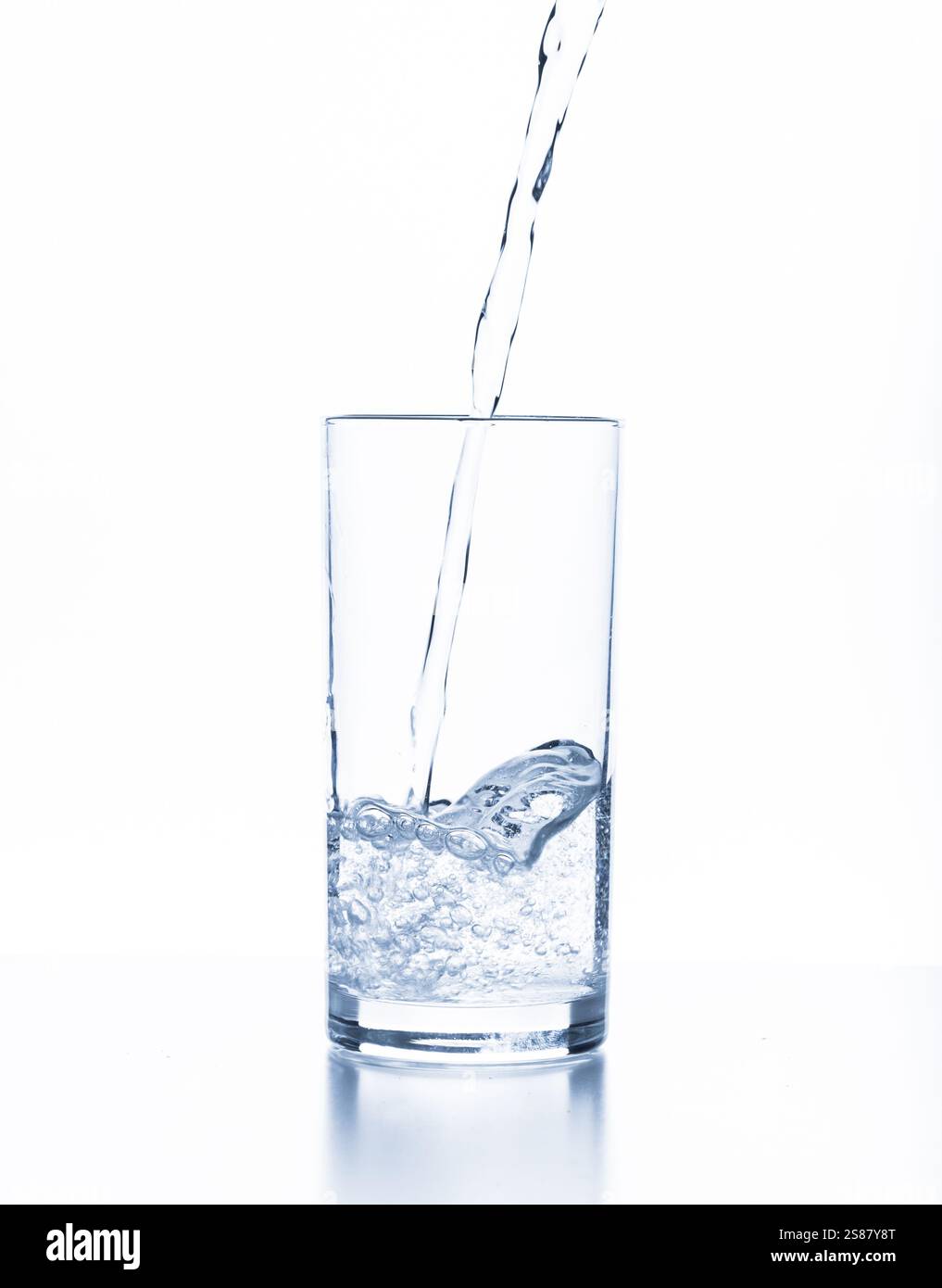 water splashing from glass isolated on white background Stock Photo - Alamy