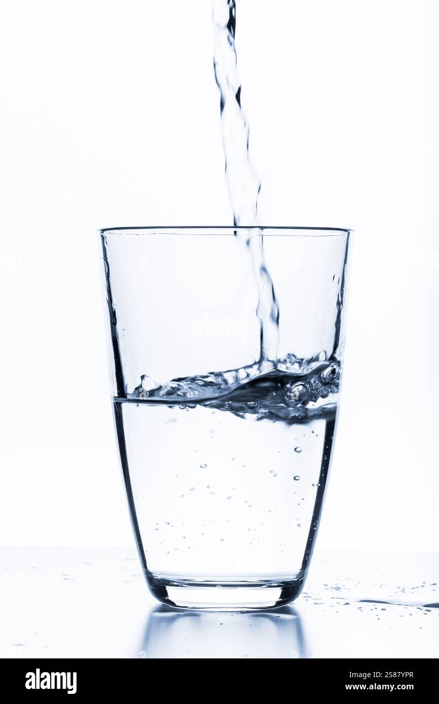 water splashing from glass isolated on white background Stock Photo - Alamy