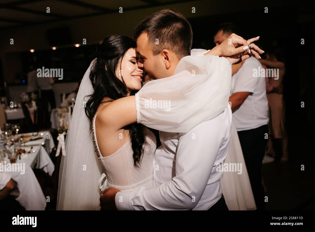 the first dance of the bride and groom inside a restaurant Stock Photo ...