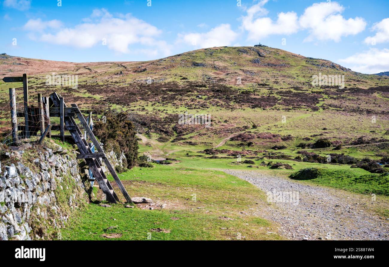 A ladder stile over a traditional Devon hedgebank, with Brat Tor and ...