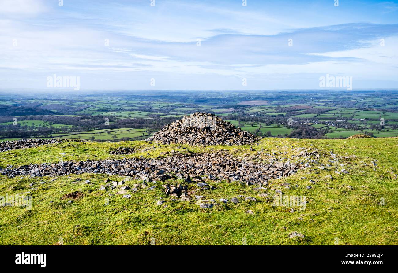 Ring cairn on the summit of Great Nodden, with view south to fields of ...