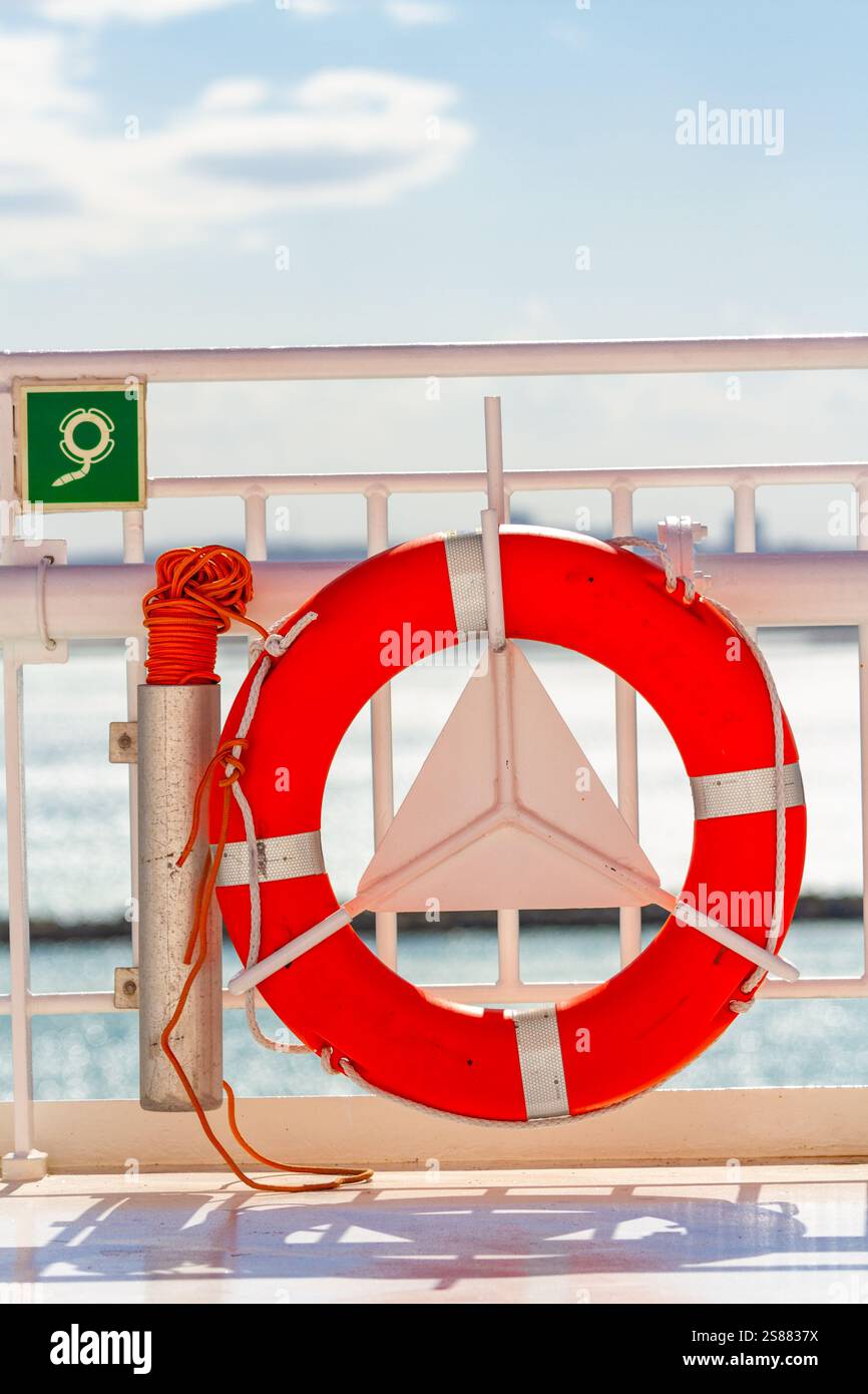 Background. Close-up. A red lifebelt on the railing of a passenger ...