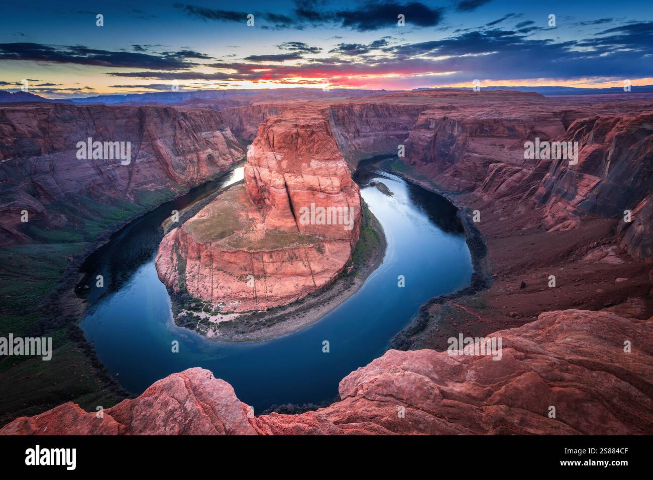 Horseshoe Bend at sunset reveals the Colorado River curving through red ...