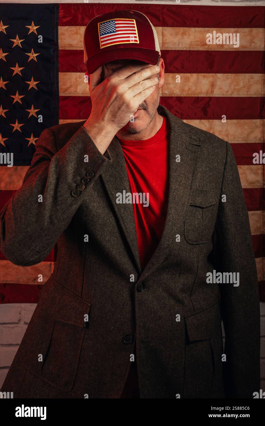 American man covering his face, American flag background Stock Photo ...