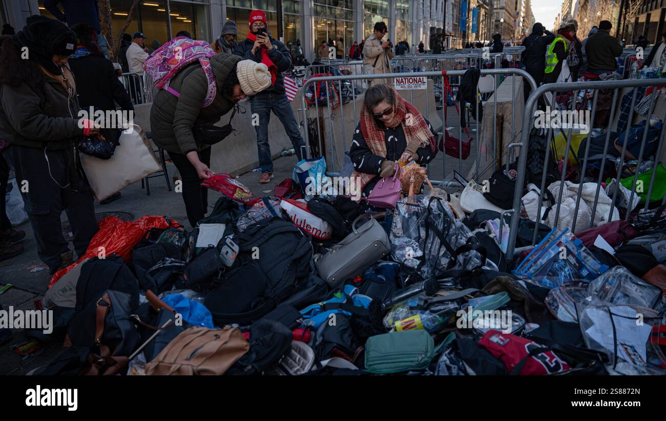 Individuals sift through a pile of trash and debris outside the Capital ...