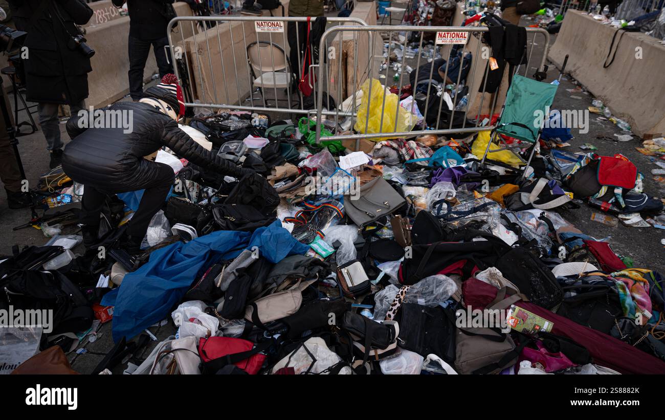 A woman sifts through a pile of trash and debris outside the Capital ...