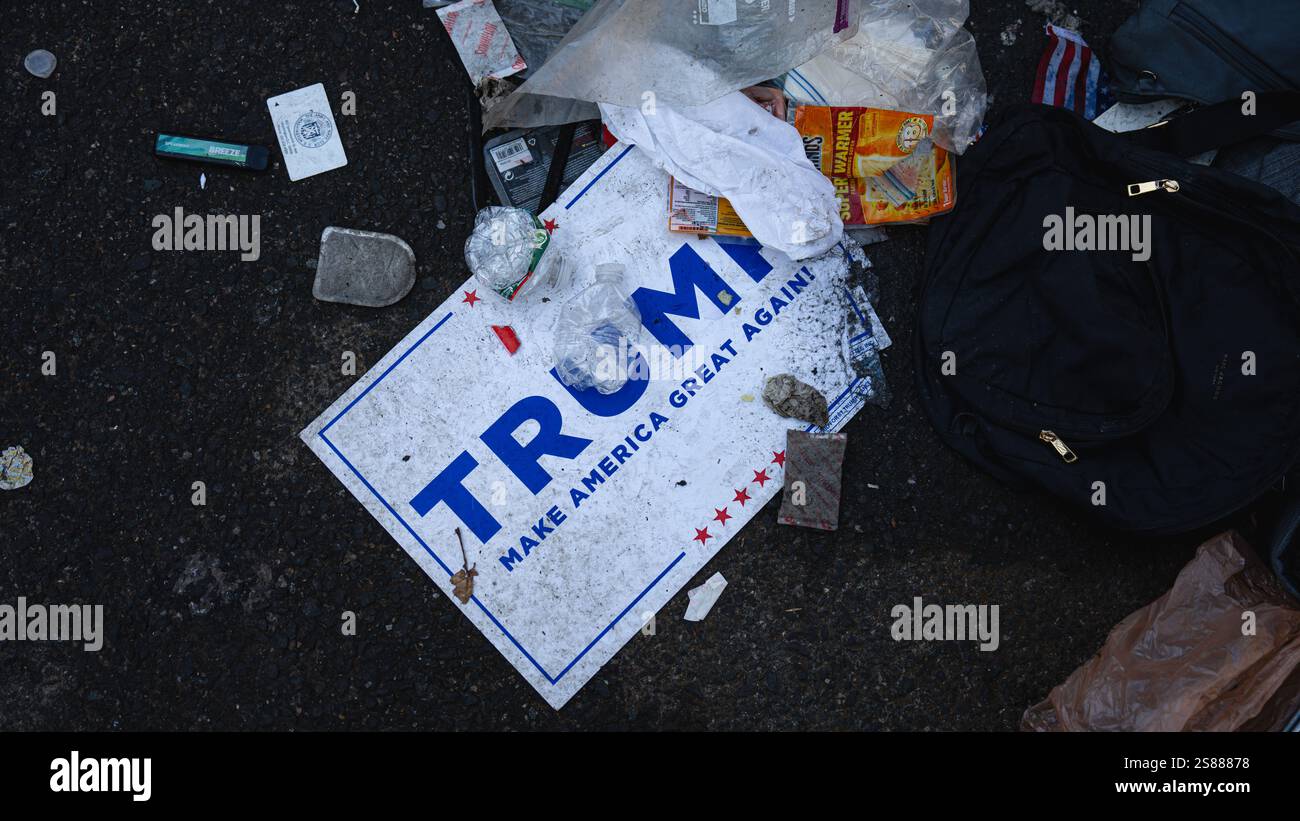 A ‘Trump’ sign lays on the ground amind trash and debris outside the ...