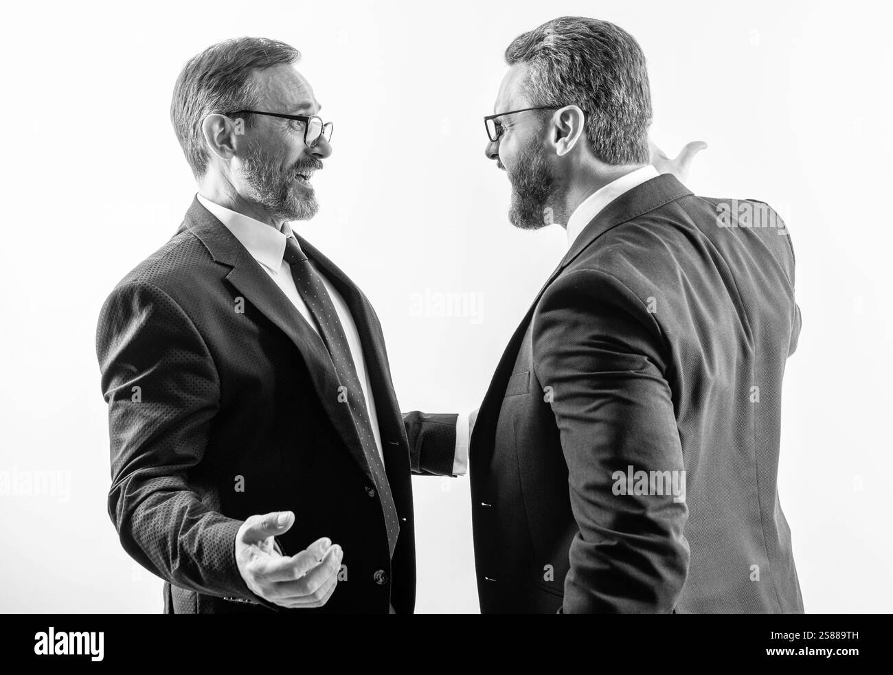 two businessmen fighting at rivalry isolated on white. businessmen ...