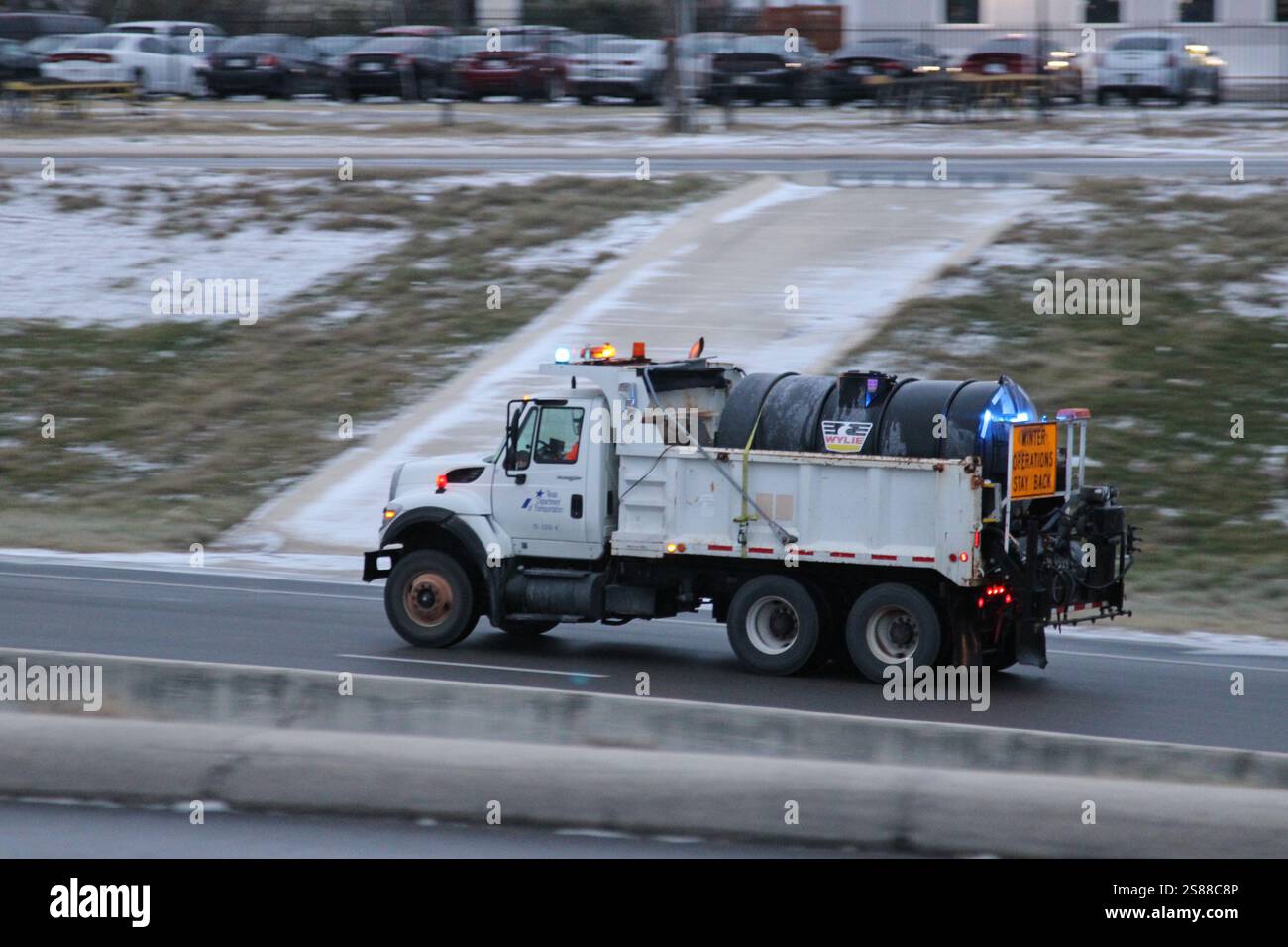 San Antonio, USA. 21st Jan, 2025. A TxDOT truck applies brine on ...