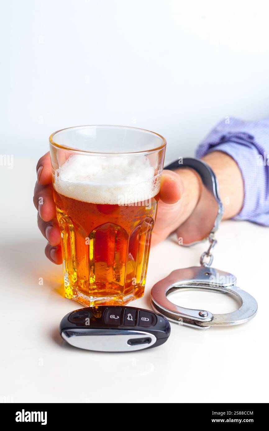 Drunk Driving Concept - Beer, Keys and Handcuffs Stock Photo - Alamy