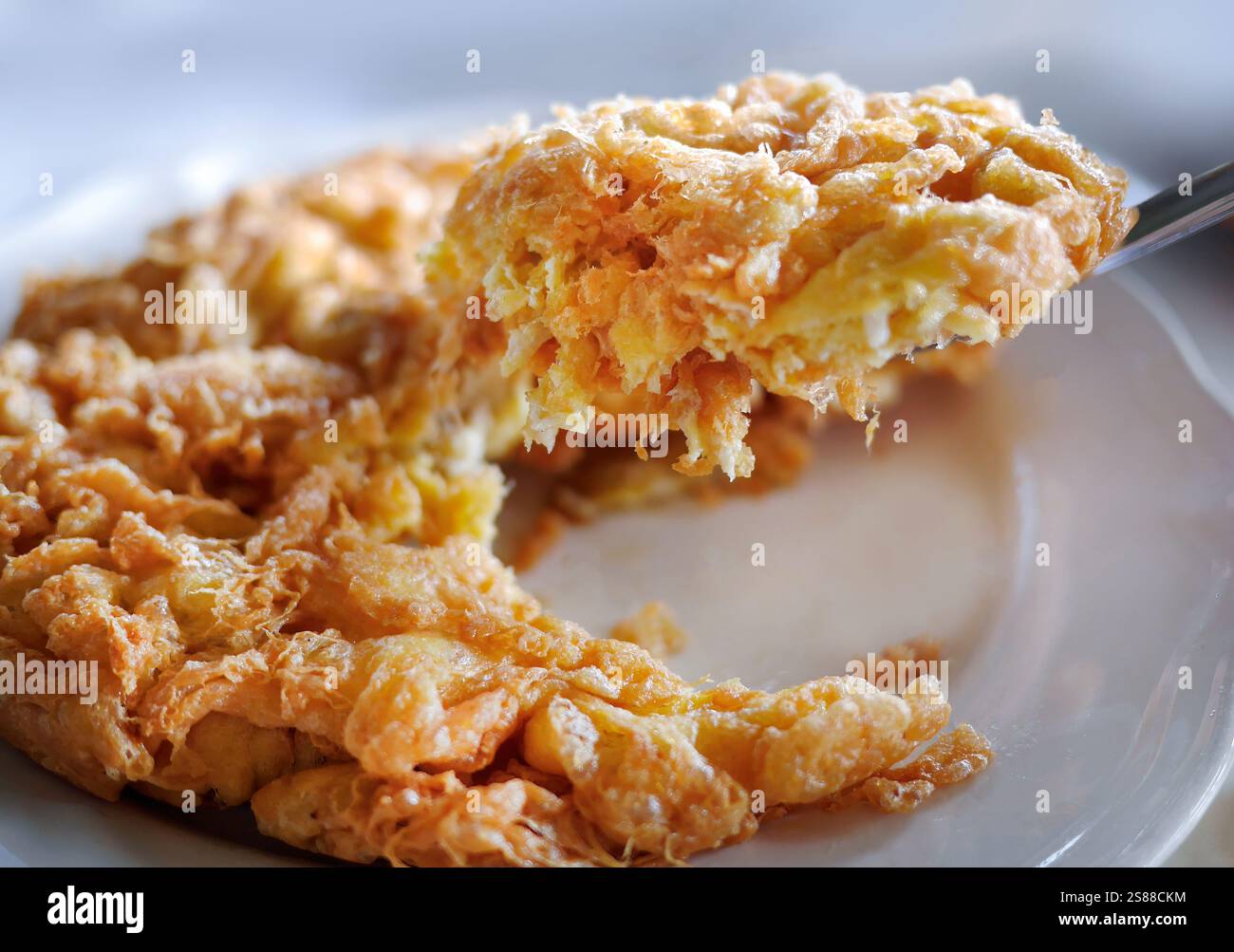 Deep fried crab omelette Thai style, crispy, thick and oily, unhealthy ...
