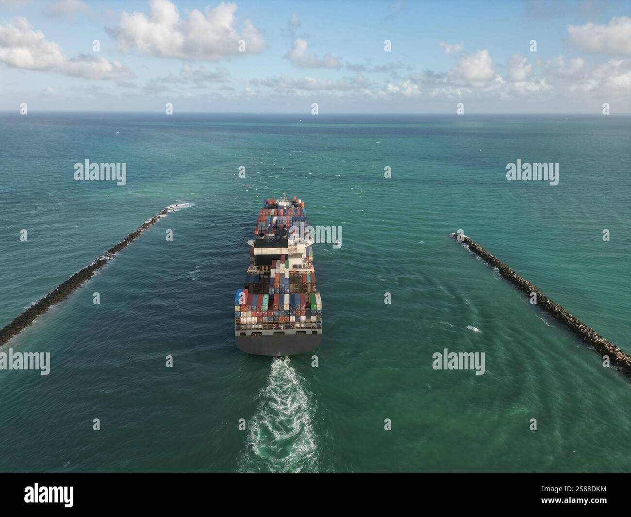 Freight container loaded on cargo vessel in Miami. Aerial view cargo ...