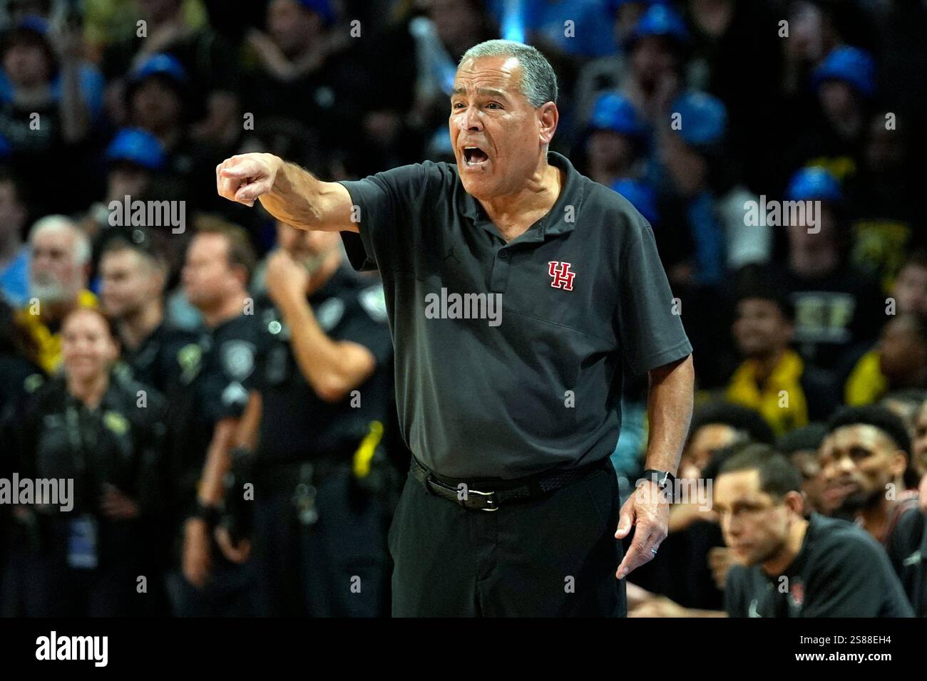 Houston head coach Kelvin Sampson directs his players during the second ...