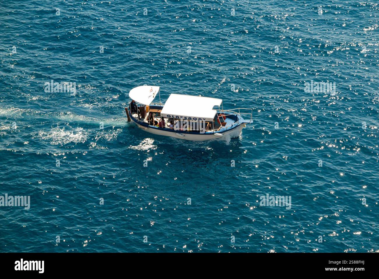 Glass bottom tourist boat giving tourists trip around Lokrum Island and ...