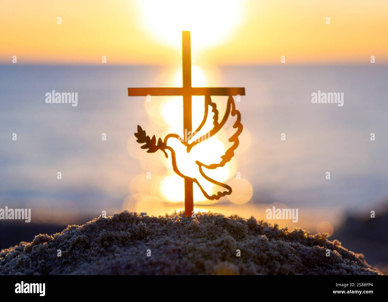 Black silhouette of stick in shape of cross and dove with branch with ...