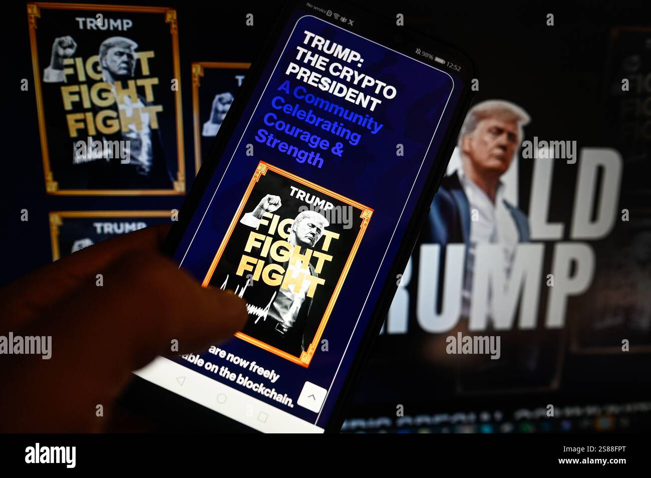 In this photo illustration, the Trump Token meme logo is displayed on a ...