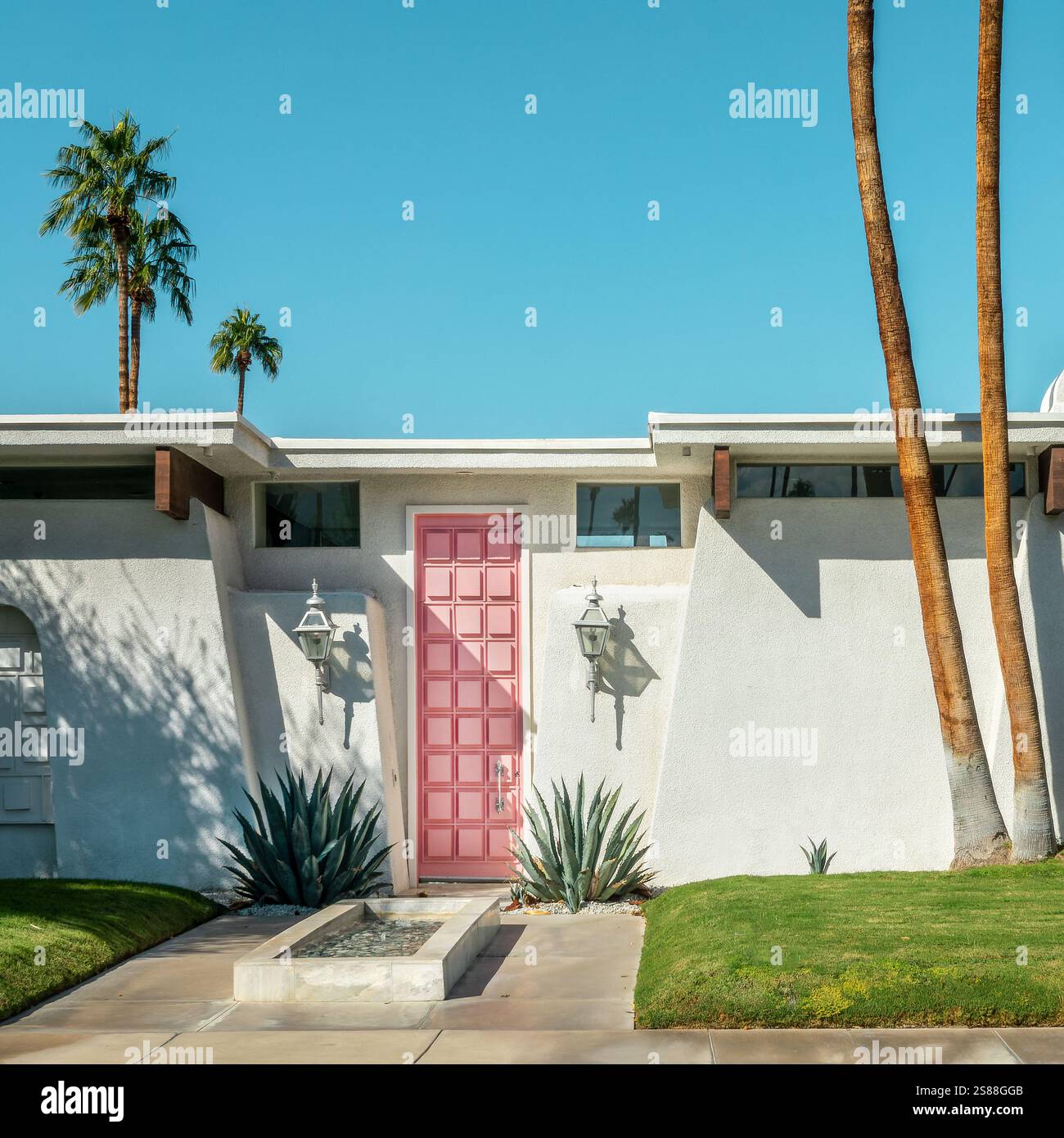 Modern mid-century architecture house with a colorful door in Palm ...