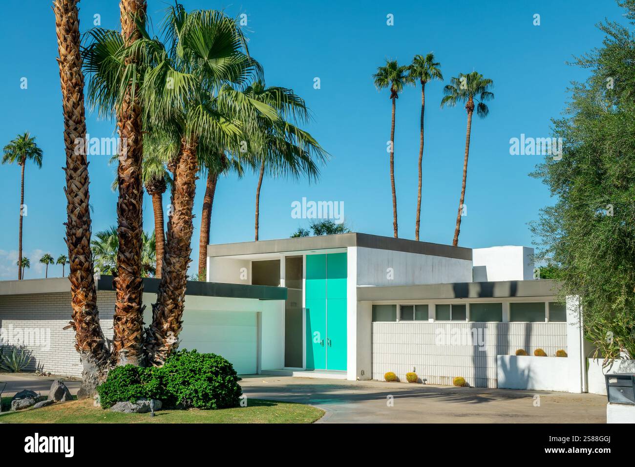 Modern mid-century architecture house with a colorful door in Palm ...