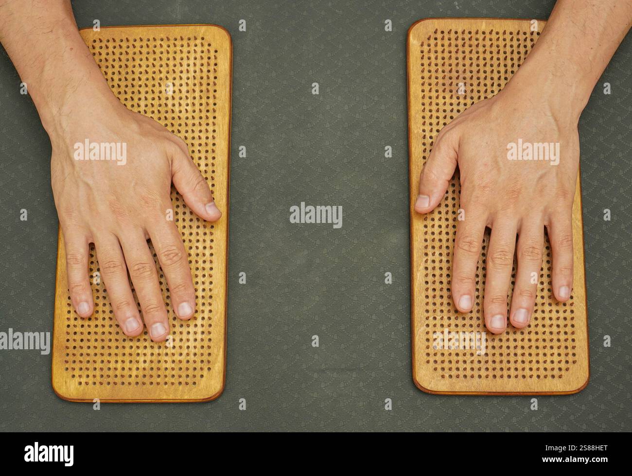 The nails in the sadhu board symbolize endurance and concentration on ...
