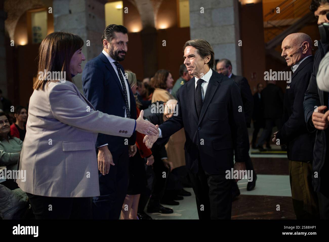 Former Prime Minister José María Aznar greets his arrival at the ...