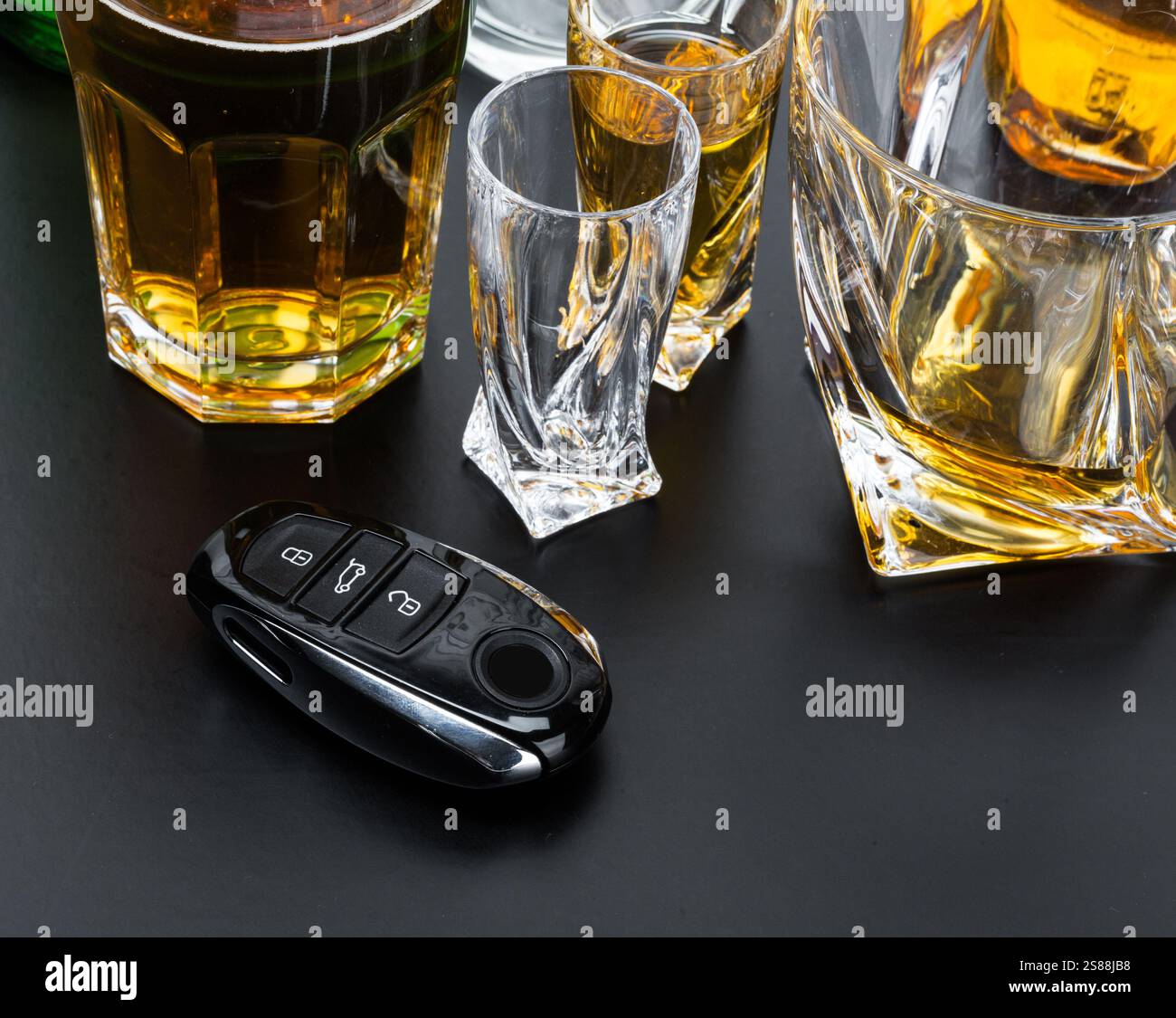 Car key on the bar with spilled alcohol Stock Photo - Alamy