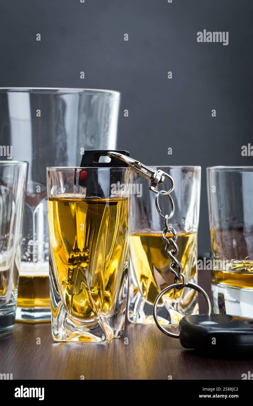Car key on the bar with spilled alcohol Stock Photo - Alamy