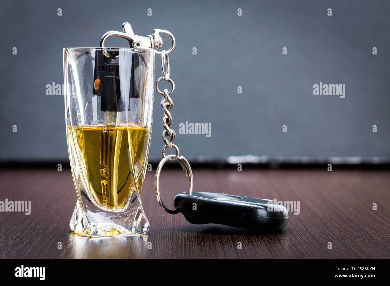 Car key on the bar with spilled alcohol Stock Photo - Alamy