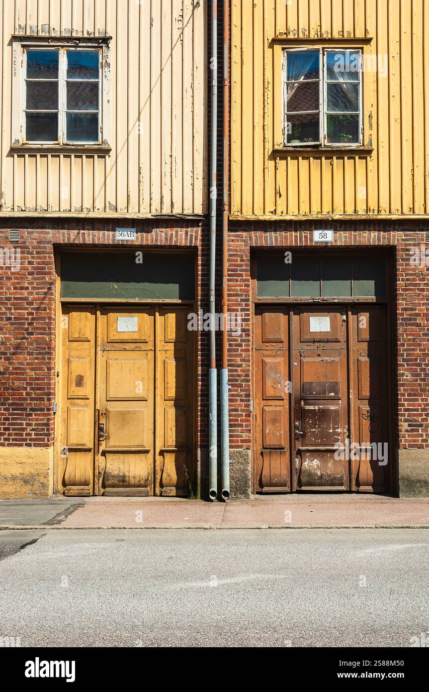 Two contrasting entrances showcase the rough architecture of buildings ...