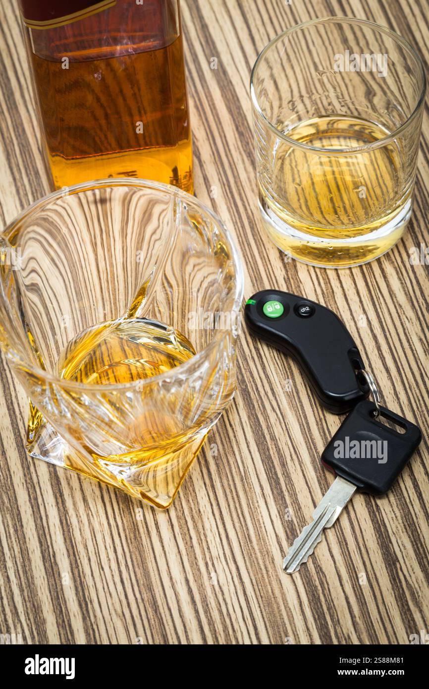 Car key on the bar with spilled alcohol Stock Photo - Alamy