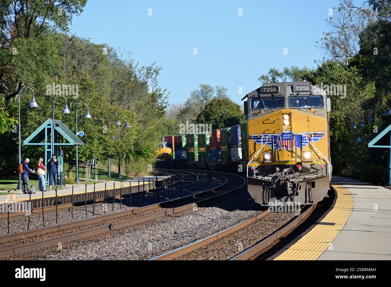 Winfield, Illinois, USA. Union Pacific Railroad locommotive lead a freight train into a curve ...
