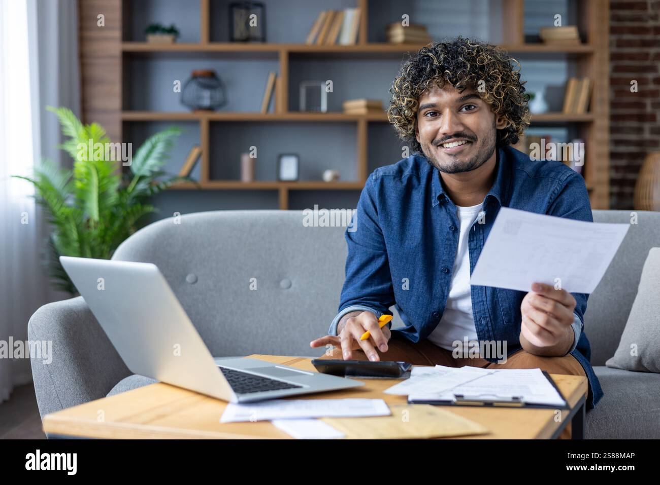 Indian man home checks receipt hi-res stock photography and images - Alamy