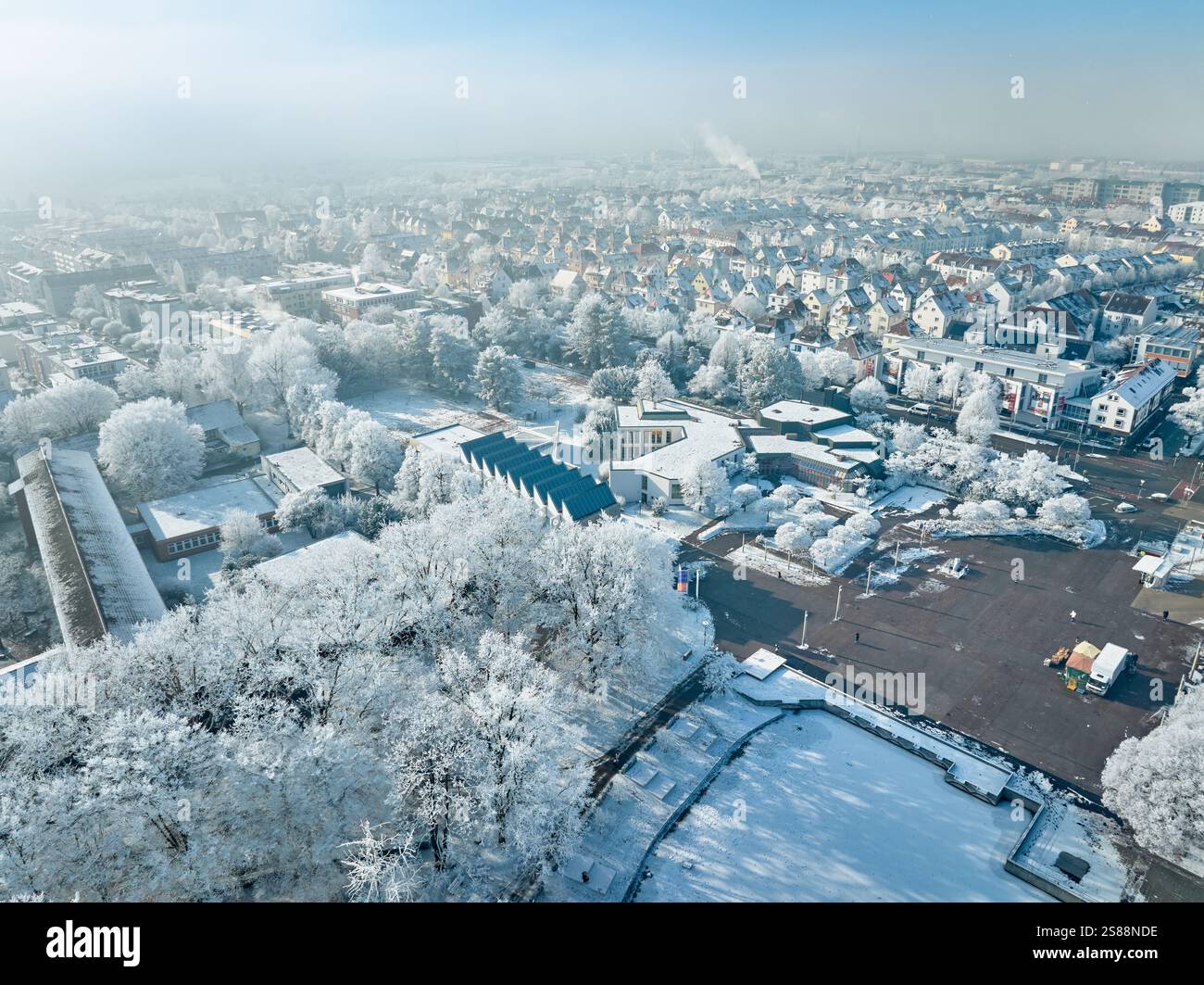 Aerial photo of a snowy town square with the art Galery in the Kleihus ...