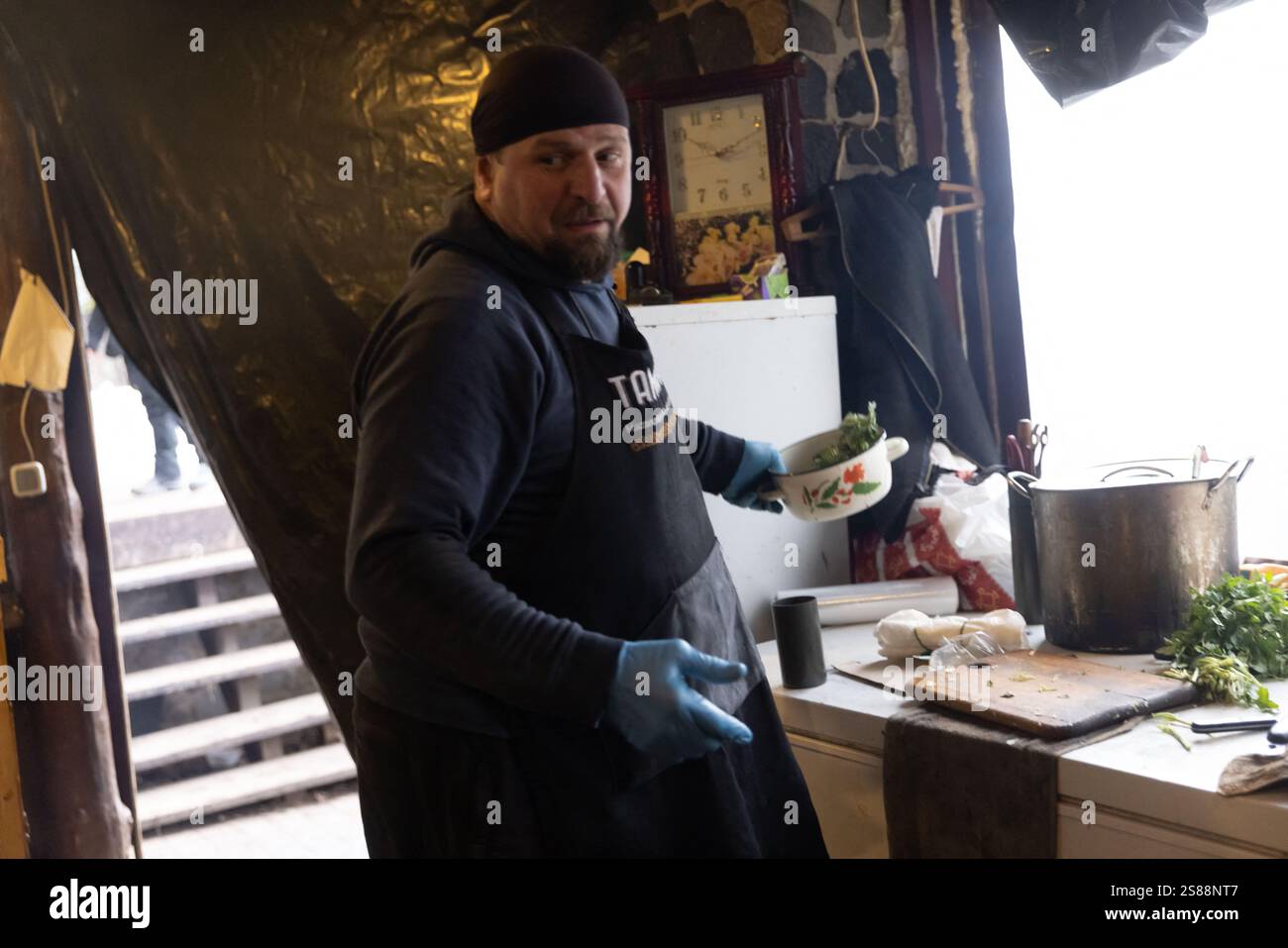 The serviceman, nicknamed Uncle Liova, prepares meals for his comrades ...