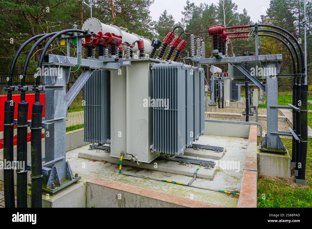 Modern electrical equipment in an outdoor electrical substation, two ...