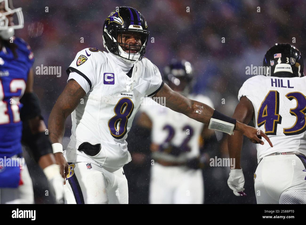 Baltimore Ravens quarterback Lamar Jackson (8) points during the second ...