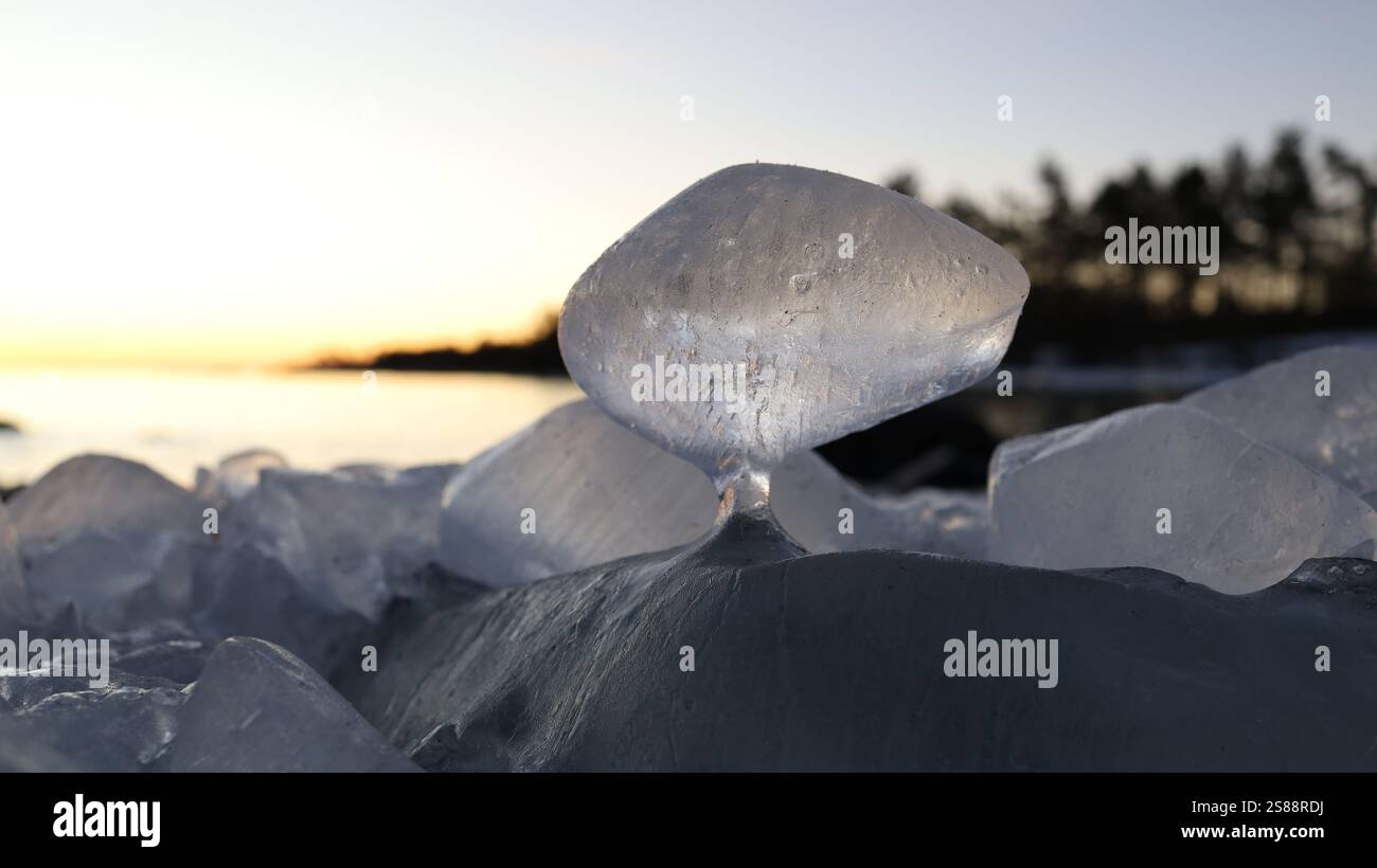 Close up of a natural transparent ice formation on the beach. Beach ...