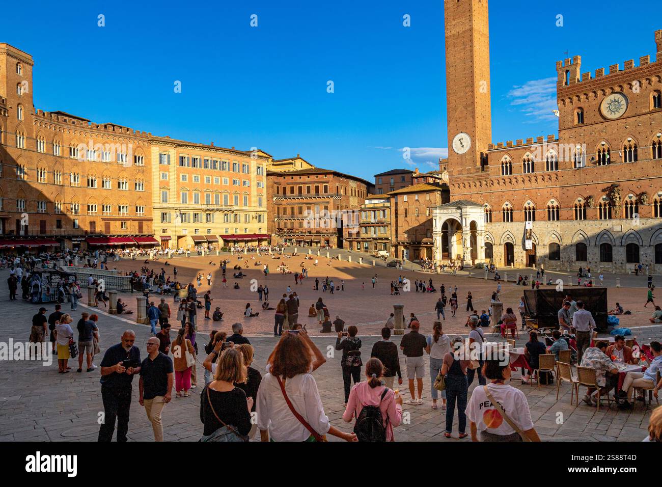 People at Piazza del Campo,the main public space in the historic centre ...
