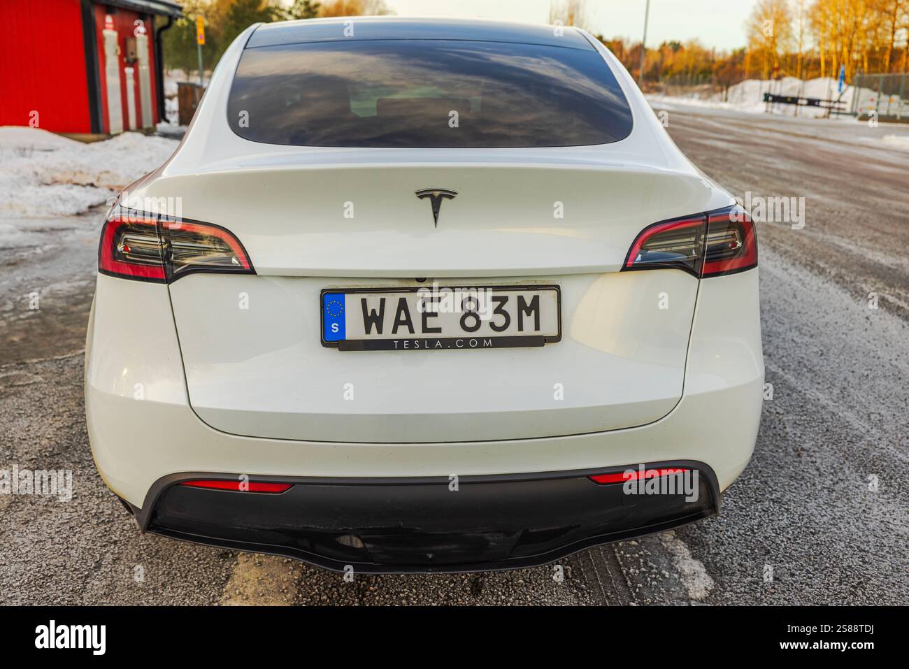 Tesla Model Y rear view with Swedish license plate on winter road ...