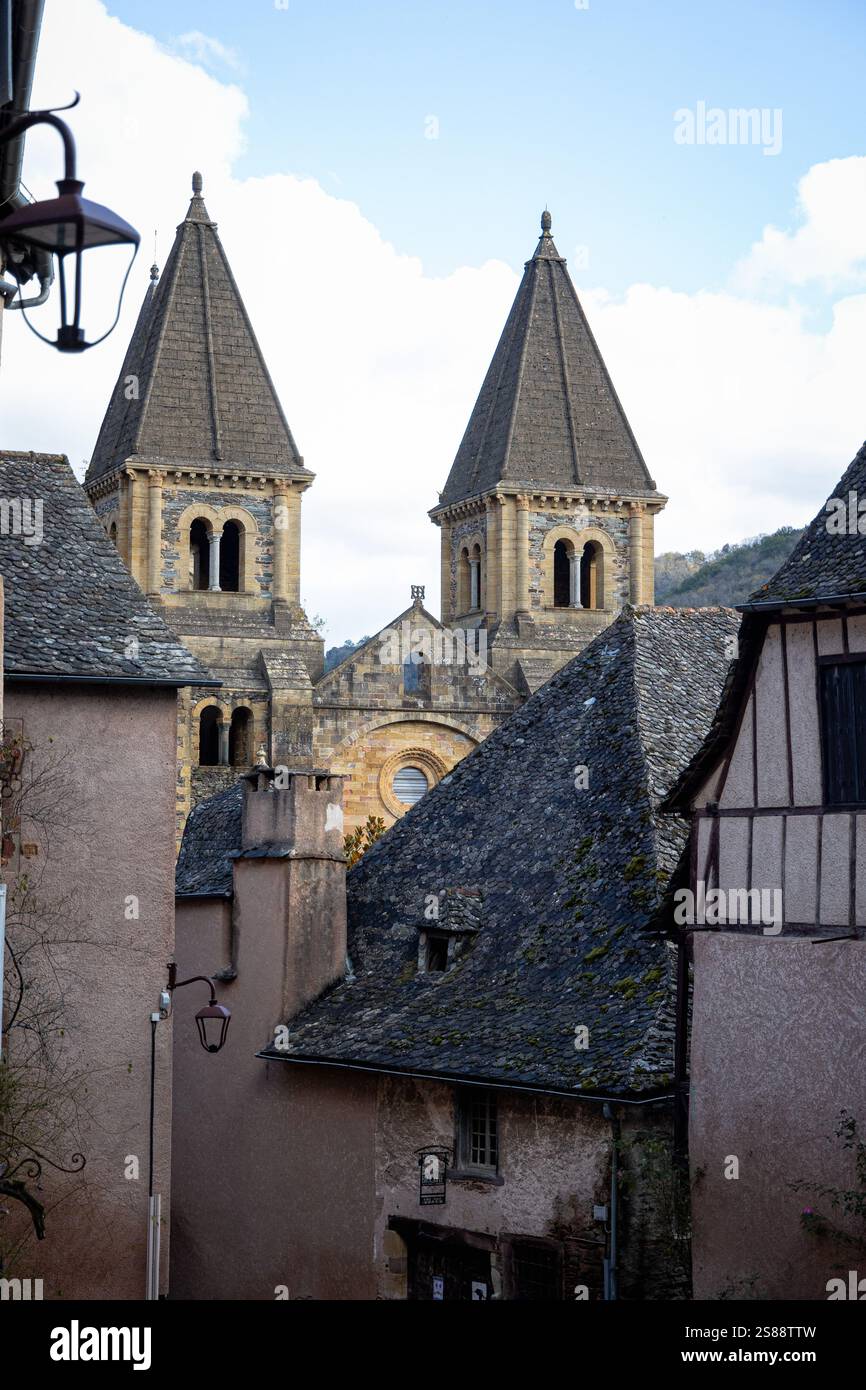 A close-up view of the twin spires of the Abbey Church of Sainte-Foy ...
