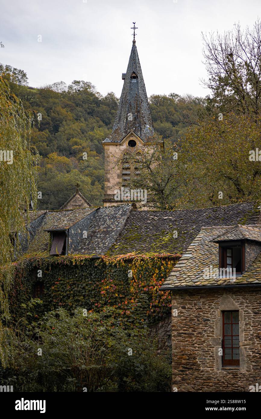 Enchanting view of a historic church tower with a slate roof rising ...