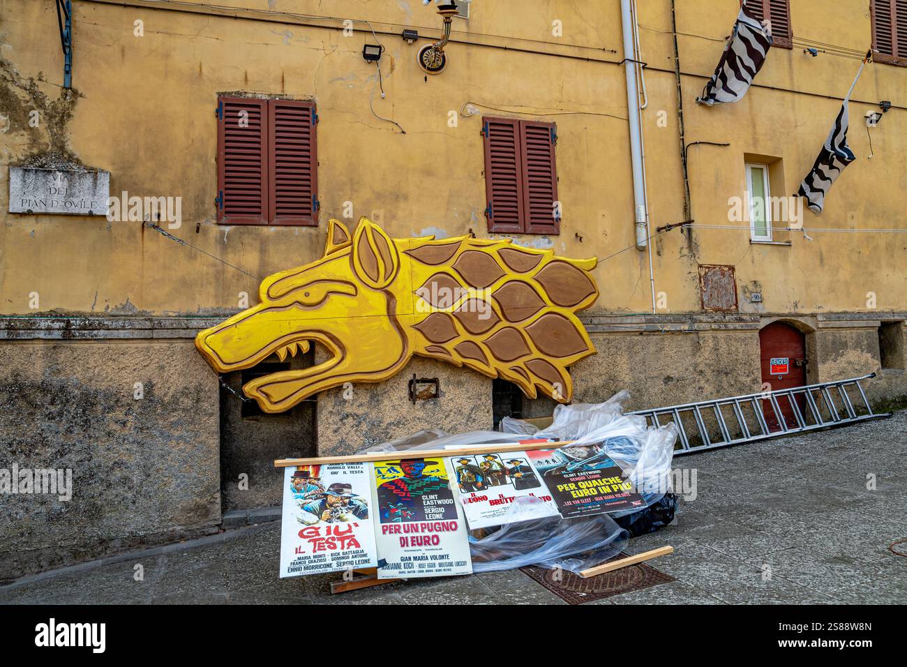 A wall plaque showing the head of a she-wolf the symbol of the Contrada ...