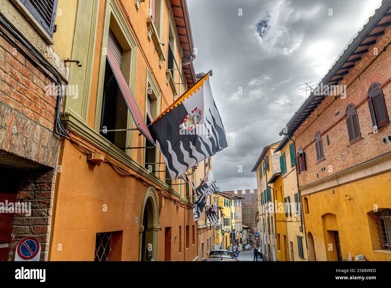 The flag of the Contrada della Lupa (She -Wolf) hanging on a building ...