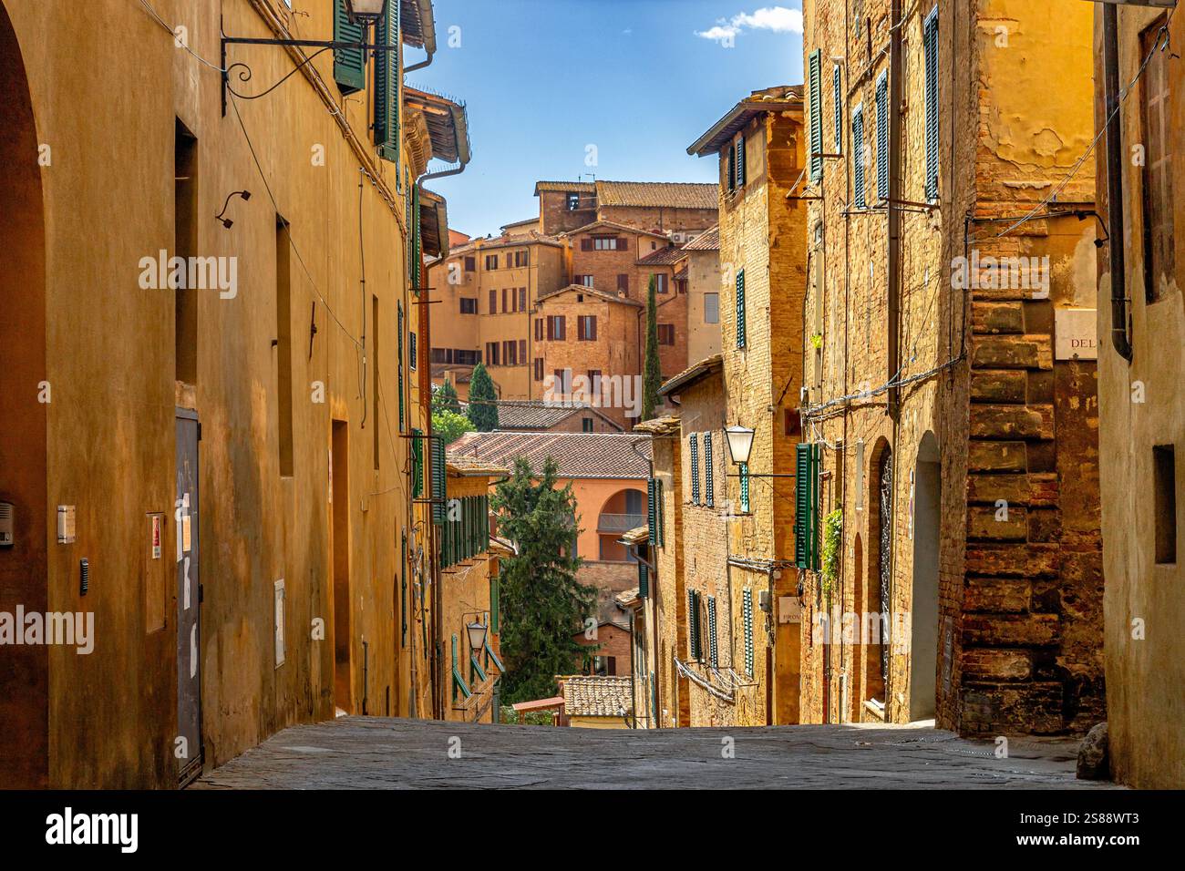 A view of old buildings in Siena along Via de Mezzo a street in the ...