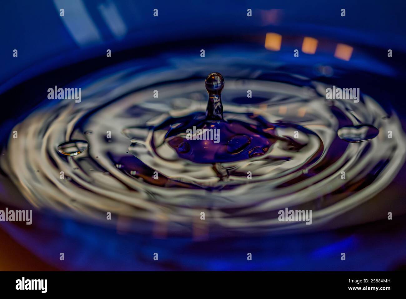 Water dripping into a glass bowl Stock Photo - Alamy