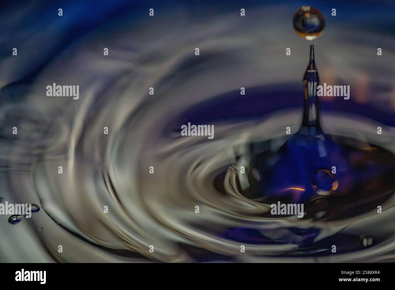 Water dripping into a glass bowl Stock Photo - Alamy