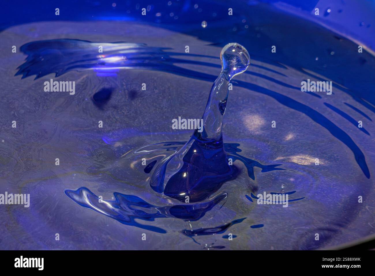 Water dripping into a glass bowl Stock Photo - Alamy