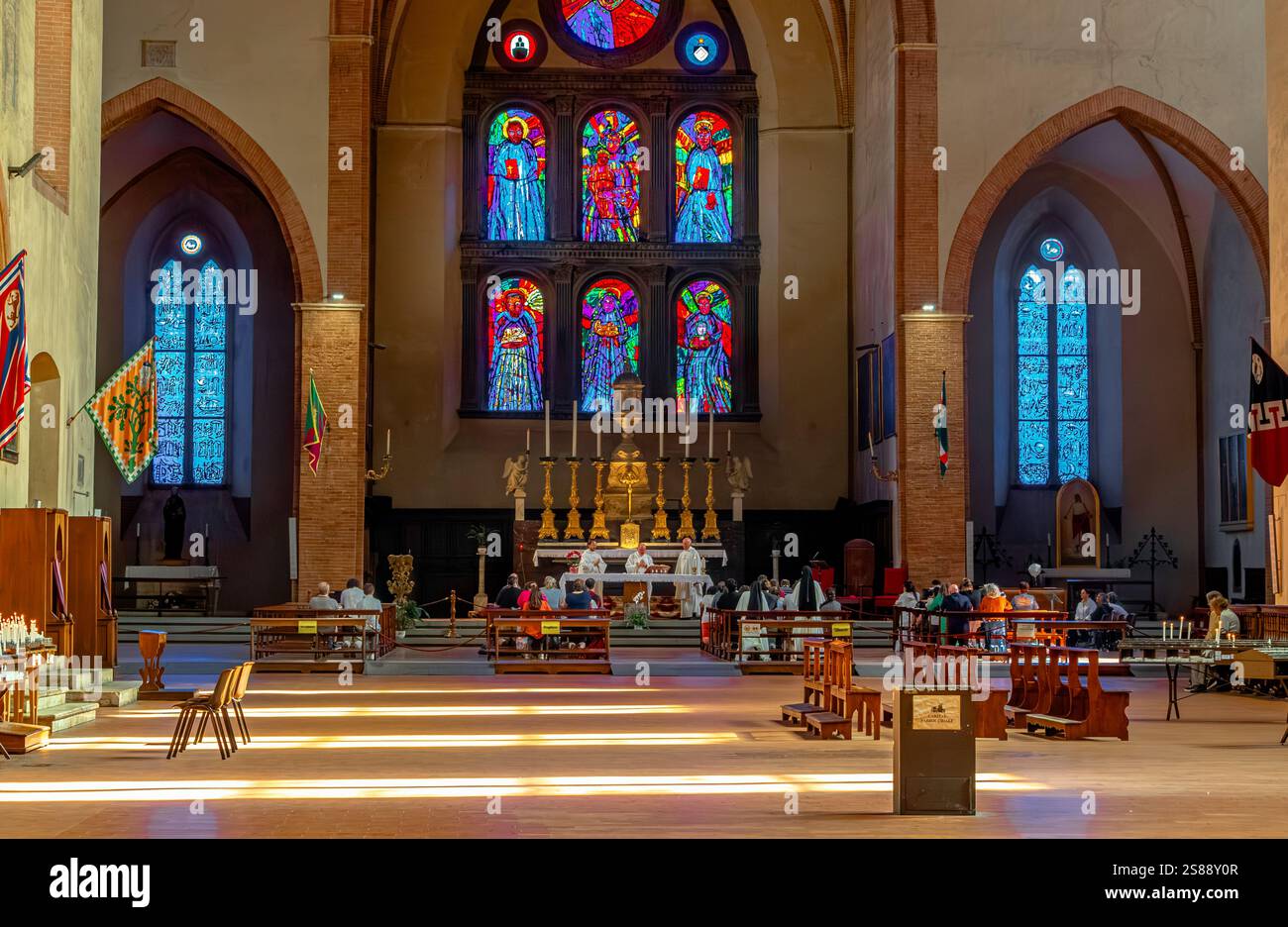 Stained glass windows above the main altar inside The Basilica Of San ...